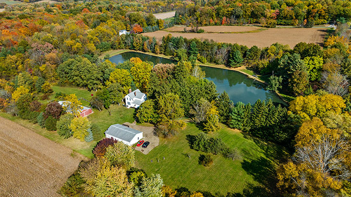 53-Acre Hideaway Farm With 3.5-Acre Stocked Lake & Elegant Farmhouse